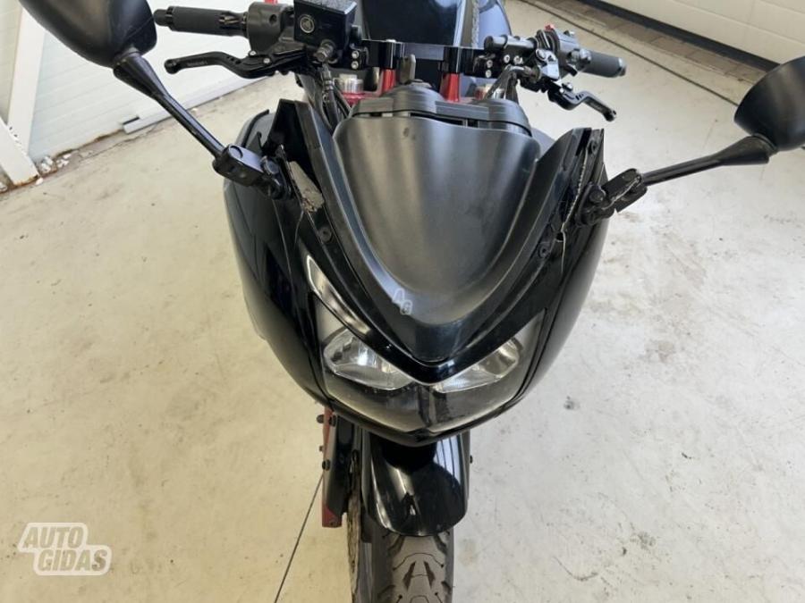 Black Kawasaki ER 2007 in Radviliskis, with an engine capacity of 0.65 L and mileage of 63 thousand km for 1550 €, photo 18 on AUTOMOTO.COM.LV