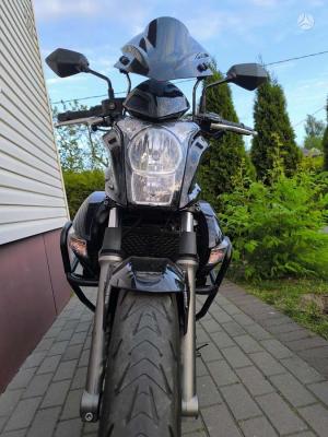 Black Kawasaki ER 2009 in Vilnius, with an engine capacity of 0.65 L and mileage of 52 thousand km for 3000 €, photo 3 on AUTOMOTO.COM.LV