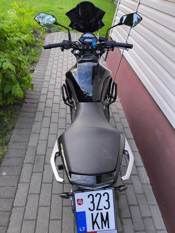 Black Kawasaki ER 2009 in Vilnius, with an engine capacity of 0.65 L and mileage of 52 thousand km for 3000 €, photo 6 on AUTOMOTO.COM.LV