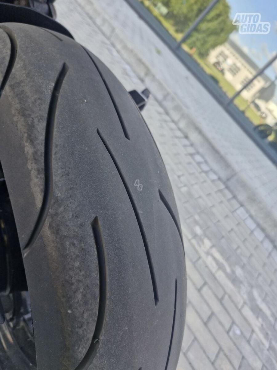 Black Kawasaki ER 2011 in Kaunas, with an engine capacity of 0.65 L and mileage of 46 thousand km for 2700 €, photo 12 on AUTOMOTO.COM.LV