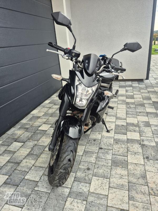 Black Kawasaki ER 2012 in Vilnius, with an engine capacity of 0.65 L and mileage of 35 thousand km for 3333 €, photo 3 on AUTOMOTO.COM.LV