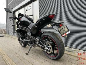 Black Kawasaki ER 2015 in Riga, with an engine capacity of 0.65 L and mileage of 30 thousand km for 3699 €, photo 3 on AUTOMOTO.COM.LV