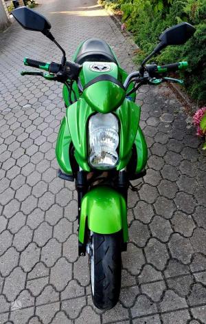 Green Kawasaki ER 2008 in Pasvalys, with an engine capacity of 0.65 L and mileage of 65 thousand km for 2050 €, photo 5 on AUTOMOTO.COM.LV