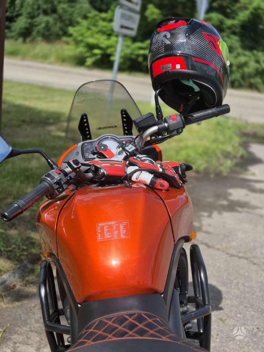Red Kawasaki Versys 2007 in Kaunas, with an engine capacity of 0.65 L and mileage of 47 thousand km for 3100 €, photo 4 on AUTOMOTO.COM.LV