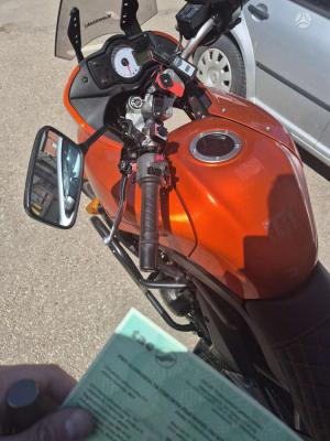 Red Kawasaki Versys 2007 in Kaunas, with an engine capacity of 0.65 L and mileage of 47 thousand km for 3100 €, photo 6 on AUTOMOTO.COM.LV