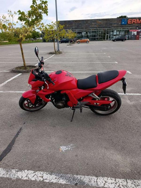 Red Kawasaki Z 2006 in Mazeikiai, with an engine capacity of 0.75 L and mileage of 47 thousand km for 2500 €, photo 5 on AUTOMOTO.COM.LV