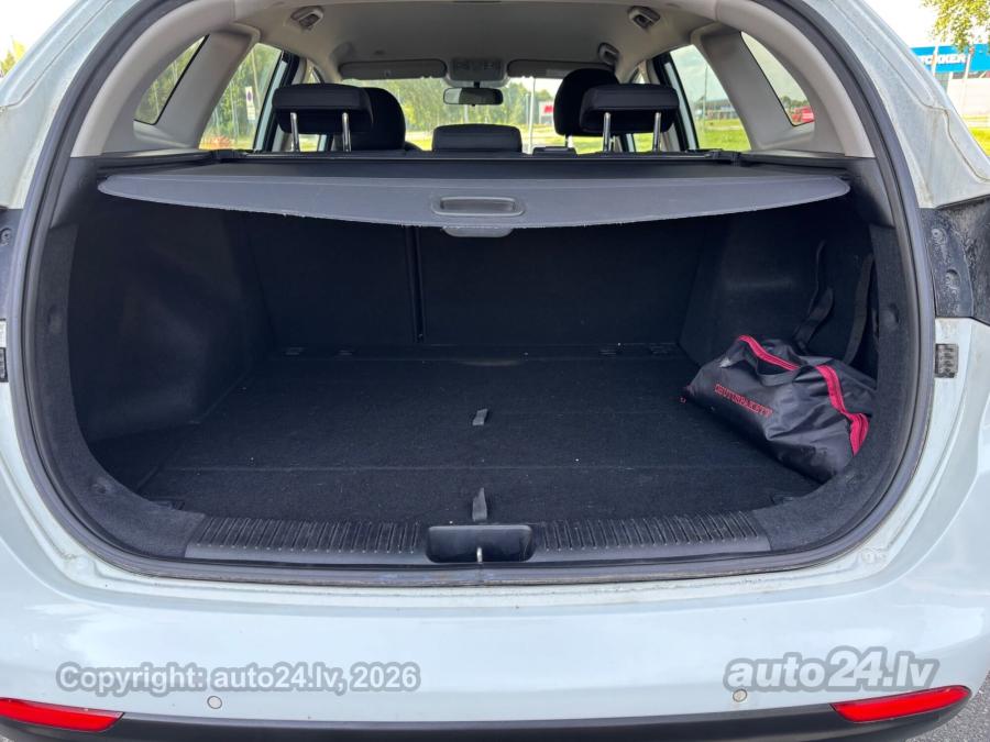 White Kia Ceed 2013 in Paide, with an engine capacity of 1.40 L and mileage of 132 thousand km for 5490 €, photo 21 on AUTOMOTO.COM.LV