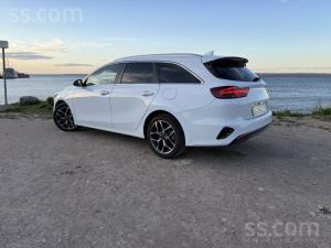White Kia Ceed 2022 in Riga, with an engine capacity of 1.60 L and mileage of 0 thousand km for 12950 €, photo  on AUTOMOTO.COM.LV