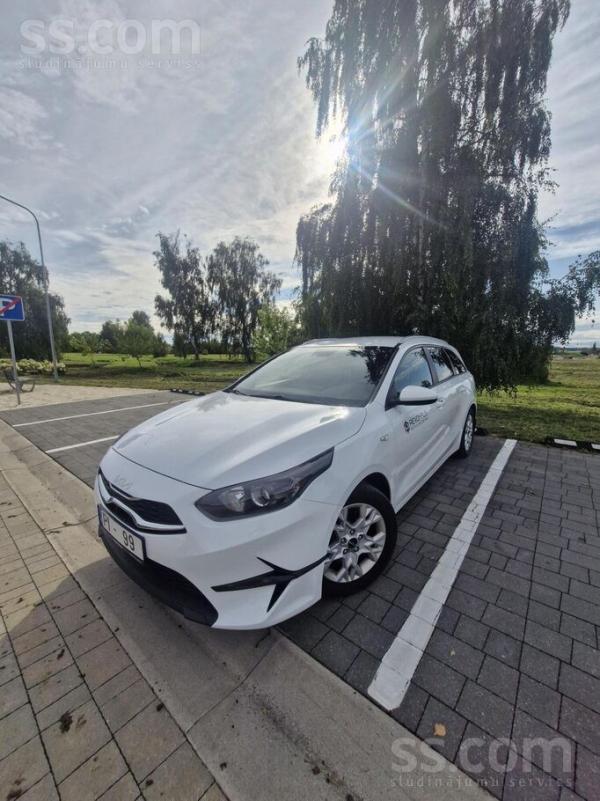 White Kia Ceed 2023 in Riga, with an engine capacity of 1.50 L and mileage of 90 thousand km for 14200 €, photo 1 on AUTOMOTO.COM.LV