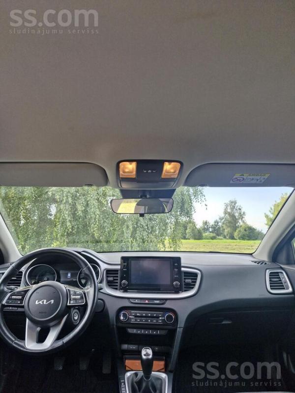 White Kia Ceed 2023 in Riga, with an engine capacity of 1.50 L and mileage of 90 thousand km for 14200 €, photo 5 on AUTOMOTO.COM.LV