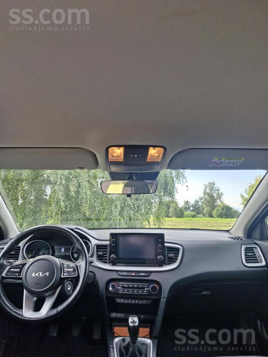 White Kia Ceed 2023 in Riga, with an engine capacity of 1.50 L and mileage of 90 thousand km for 14200 €, photo 6 on AUTOMOTO.COM.LV