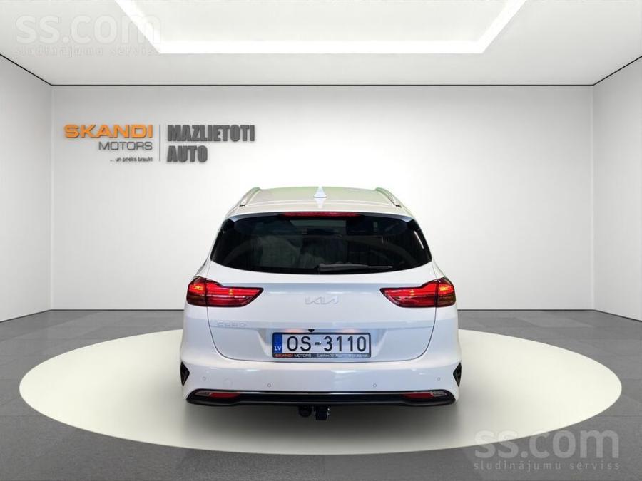 White Kia Ceed 2023 in Riga, with an engine capacity of 1.50 L and mileage of 92 thousand km for 14990 €, photo 6 on AUTOMOTO.COM.LV