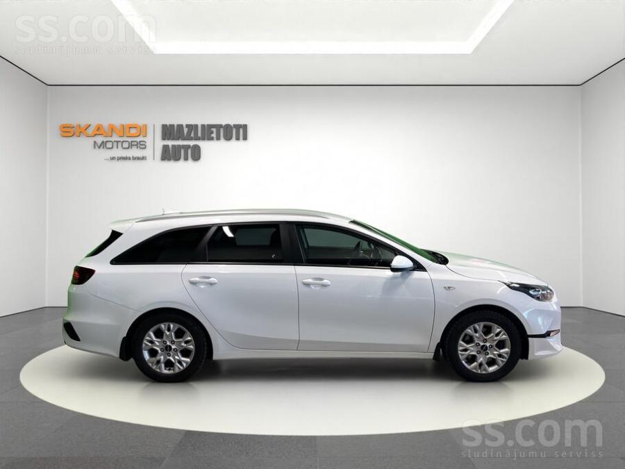 White Kia Ceed 2023 in Riga, with an engine capacity of 1.50 L and mileage of 92 thousand km for 14990 €, photo 8 on AUTOMOTO.COM.LV
