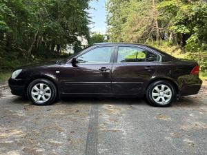 Red Kia Magentis 2007 in Vilnius, with an engine capacity of 2.00 L and mileage of 170 thousand km for 1250 €, photo 8 on AUTOMOTO.COM.LV