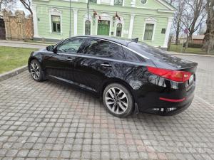 Black Kia Optima 2014 in Ventspils, with an engine capacity of 1.70 L and mileage of 145 thousand km for 7000 €, photo 4 on AUTOMOTO.COM.LV