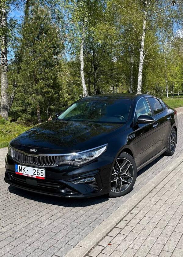 Black Kia Optima 2020 in Liepaja, with an engine capacity of 1.60 L and mileage of 70 thousand km for 12490 €, photo 1 on AUTOMOTO.COM.LV