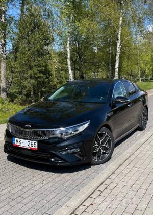 Black Kia Optima 2020 in Liepaja, with an engine capacity of 1.60 L and mileage of 70 thousand km for 12490 €, photo 1 on AUTOMOTO.COM.LV