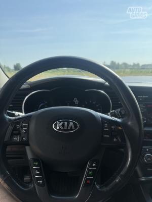Grey Kia Optima 2012 in Siauliai, with an engine capacity of 2.40 L and mileage of 390 thousand km for 5750 €, photo 13 on AUTOMOTO.COM.LV