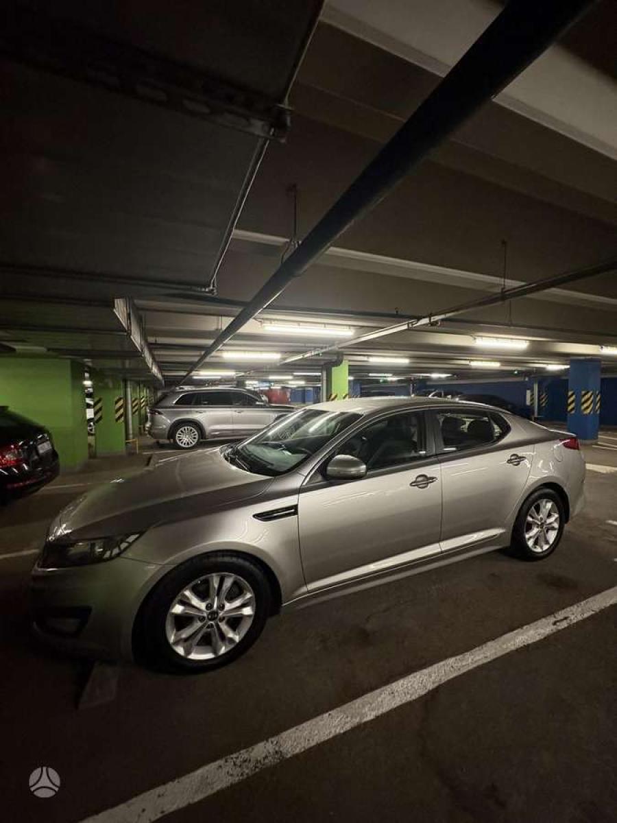 Grey Kia Optima 2015 in Vilnius, with an engine capacity of 2.36 L and mileage of 270 thousand km for 5500 €, photo 1 on AUTOMOTO.COM.LV