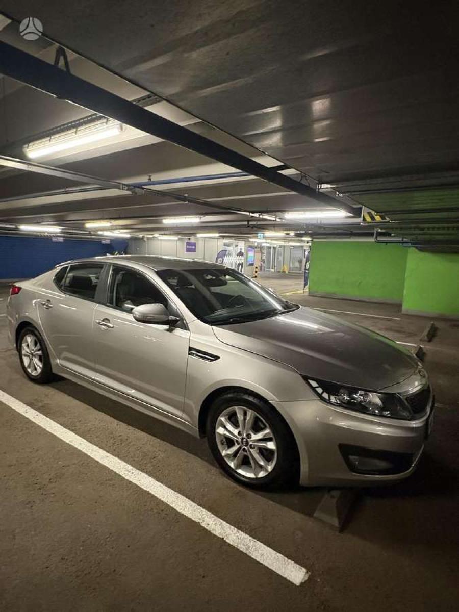 Grey Kia Optima 2015 in Vilnius, with an engine capacity of 2.36 L and mileage of 270 thousand km for 5500 €, photo 3 on AUTOMOTO.COM.LV