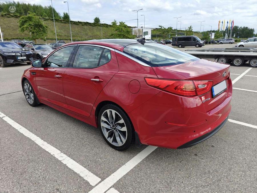 Red Kia Optima 2015 in Vilnius, with an engine capacity of 1.69 L and mileage of 186 thousand km for 7700 €, photo 6 on AUTOMOTO.COM.LV