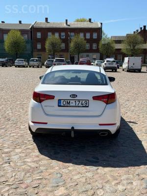 White Kia Optima 2013 in Liepaja, with an engine capacity of 2.00 L and mileage of 232 thousand km for 5700 €, photo 7 on AUTOMOTO.COM.LV