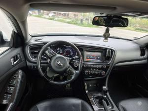 White Kia Optima 2015 in Pakruojis, with an engine capacity of 1.69 L and mileage of 24 thousand km for 6950 €, photo 8 on AUTOMOTO.COM.LV