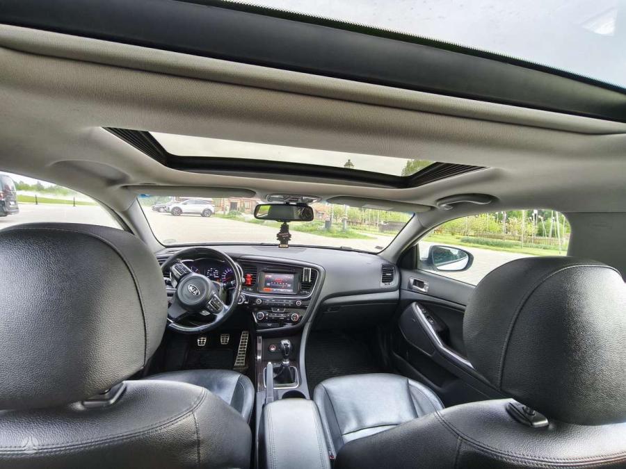 White Kia Optima 2015 in Pakruojis, with an engine capacity of 1.69 L and mileage of 24 thousand km for 6950 €, photo 9 on AUTOMOTO.COM.LV