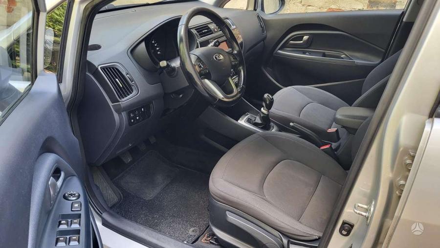 Grey Kia Rio 2015 in Vilnius, with an engine capacity of 1.12 L and mileage of 174 thousand km for 2150 €, photo 11 on AUTOMOTO.COM.LV