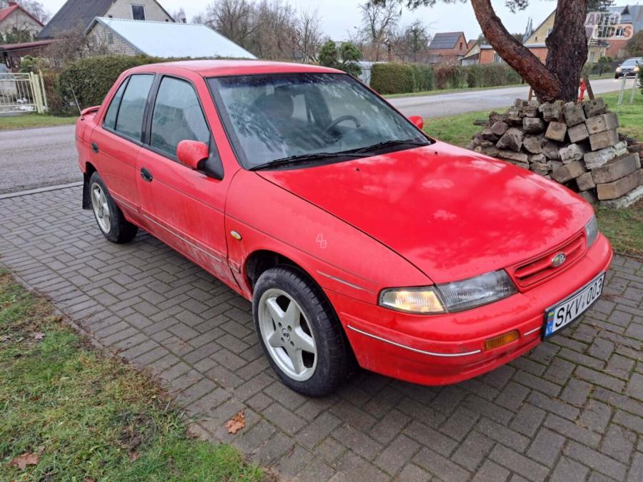 Red Kia Sephia 1994 in Panevezys, with an engine capacity of 1.60 L and mileage of 143 thousand km for 750 €, photo 1 on AUTOMOTO.COM.LV
