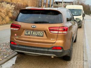 Orange Kia Sorento 2015 in Riga, with an engine capacity of 2.20 L and mileage of 209 thousand km for 12500 €, photo 9 on AUTOMOTO.COM.LV