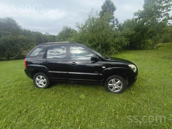 Melns Kia Sportage 2007 Liepāja, ar dzinēja tilpumu 2.00 L un nobraukumu 186 tūkst. km par 2000 €, foto 1 vietnē AUTOMOTO.COM.LV