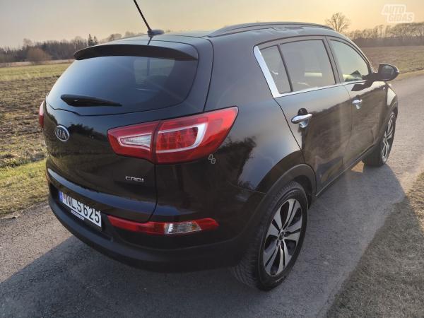 Black Kia Sportage 2010 in Pasvalys, with an engine capacity of 2.00 L and mileage of 209 thousand km for 7200 €, photo 7 on AUTOMOTO.COM.LV
