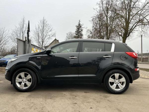 Black Kia Sportage 2011 in Siauliai, with an engine capacity of 2.00 L and mileage of 286 thousand km for 6750 €, photo 7 on AUTOMOTO.COM.LV