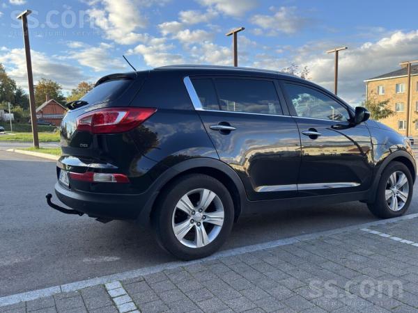Black Kia Sportage 2011 in Rezekne, with an engine capacity of 1.70 L and mileage of 247 thousand km for 6500 €, photo 6 on AUTOMOTO.COM.LV