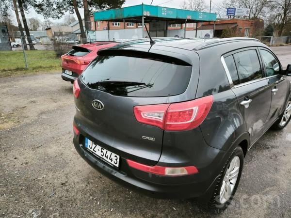 Black Kia Sportage 2012 in Riga, with an engine capacity of 1.70 L and mileage of 254 thousand km for 5100 €, photo 1 on AUTOMOTO.COM.LV