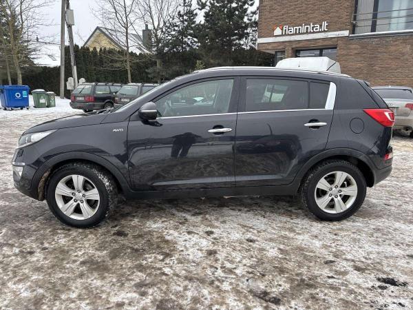 Black Kia Sportage 2012 in Kaunas, with an engine capacity of 2.00 L and mileage of 285 thousand km for 5650 €, photo 5 on AUTOMOTO.COM.LV