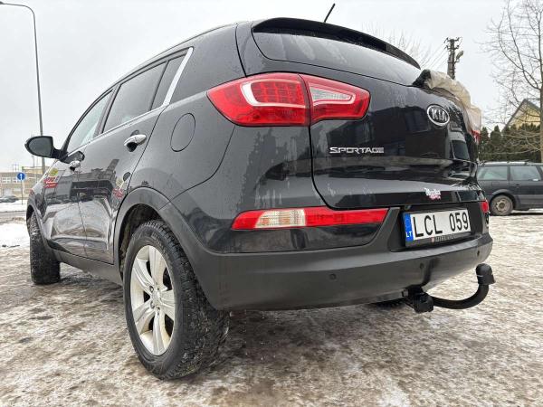 Black Kia Sportage 2012 in Kaunas, with an engine capacity of 2.00 L and mileage of 285 thousand km for 5650 €, photo 7 on AUTOMOTO.COM.LV