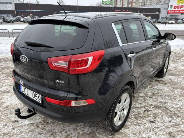 Black Kia Sportage 2012 in Kaunas, with an engine capacity of 2.00 L and mileage of 285 thousand km for 5650 €, photo 9 on AUTOMOTO.COM.LV