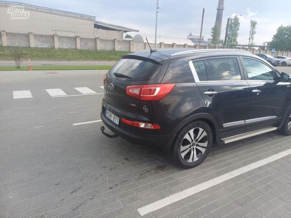 Black Kia Sportage 2012 in Klaipeda, with an engine capacity of 2.00 L and mileage of 188 thousand km for 8500 €, photo 6 on AUTOMOTO.COM.LV
