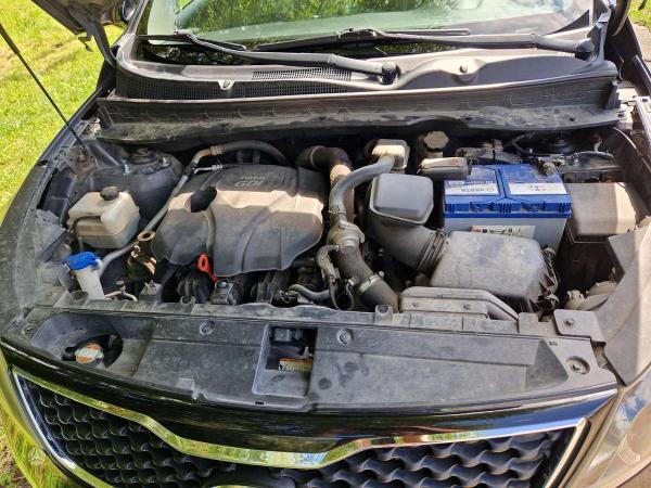 Black Kia Sportage 2012 in Mazeikiai, with an engine capacity of 2.00 L and mileage of 248 thousand km for 7600 €, photo 3 on AUTOMOTO.COM.LV