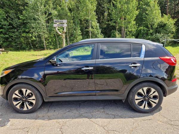 Black Kia Sportage 2012 in Mazeikiai, with an engine capacity of 2.00 L and mileage of 248 thousand km for 7600 €, photo 6 on AUTOMOTO.COM.LV