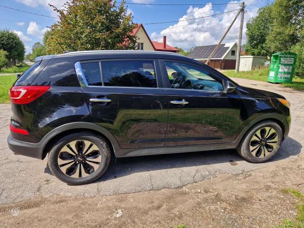 Black Kia Sportage 2012 in Mazeikiai, with an engine capacity of 2.00 L and mileage of 248 thousand km for 7600 €, photo 9 on AUTOMOTO.COM.LV