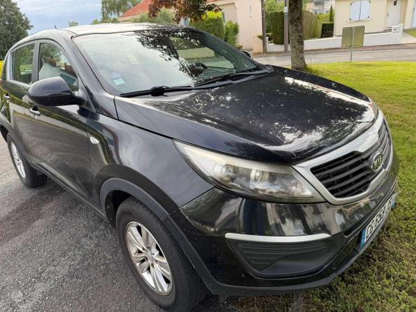 Black Kia Sportage 2012 in Kaunas, with an engine capacity of 1.59 L and mileage of 190 thousand km for 2499 €, photo 4 on AUTOMOTO.COM.LV