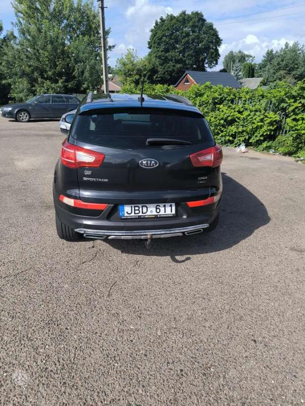 Black Kia Sportage 2012 in Kaunas, with an engine capacity of 2.00 L and mileage of 217 thousand km for 7500 €, photo 3 on AUTOMOTO.COM.LV