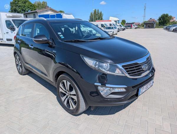 Black Kia Sportage 2012 in Taurage, with an engine capacity of 2.00 L and mileage of 245 thousand km for 6500 €, photo 4 on AUTOMOTO.COM.LV