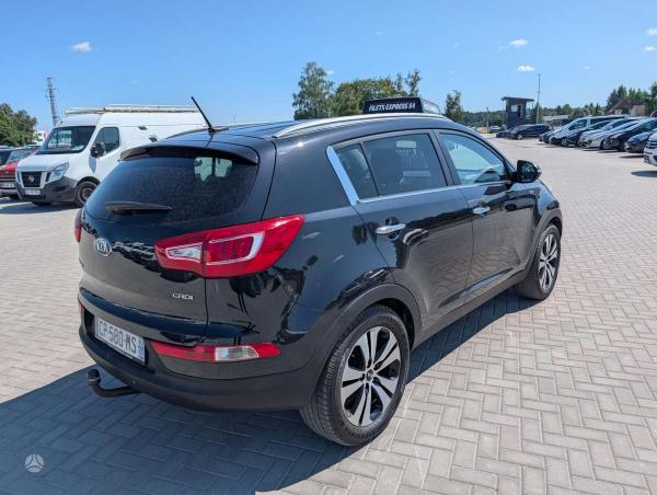 Black Kia Sportage 2012 in Taurage, with an engine capacity of 2.00 L and mileage of 245 thousand km for 6500 €, photo 6 on AUTOMOTO.COM.LV