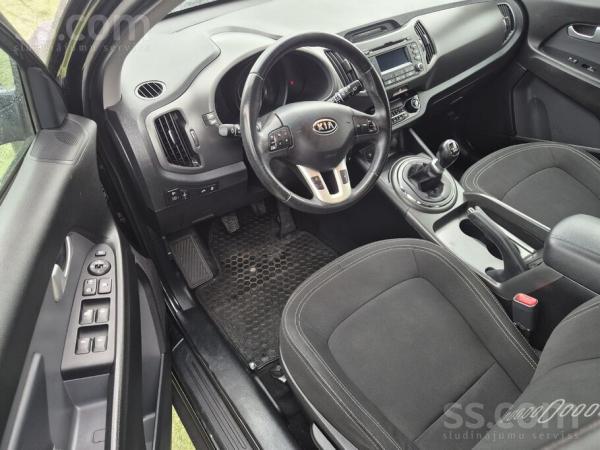 Black Kia Sportage 2012 in Liepaja, with an engine capacity of 2.00 L and mileage of 224 thousand km for 7100 €, photo 10 on AUTOMOTO.COM.LV