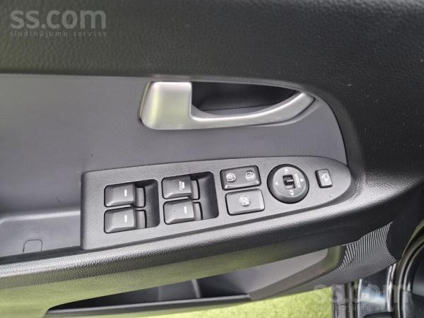 Black Kia Sportage 2012 in Liepaja, with an engine capacity of 2.00 L and mileage of 224 thousand km for 7100 €, photo 11 on AUTOMOTO.COM.LV