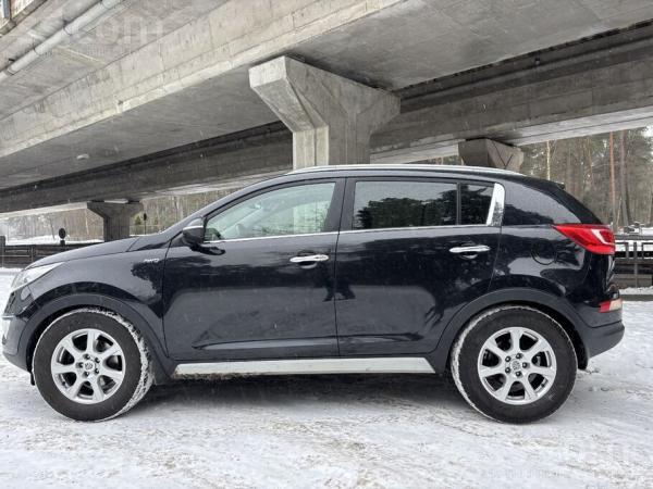 Black Kia Sportage 2013 in Riga, with an engine capacity of 2.00 L and mileage of 0 thousand km for 6990 €, photo 2 on AUTOMOTO.COM.LV